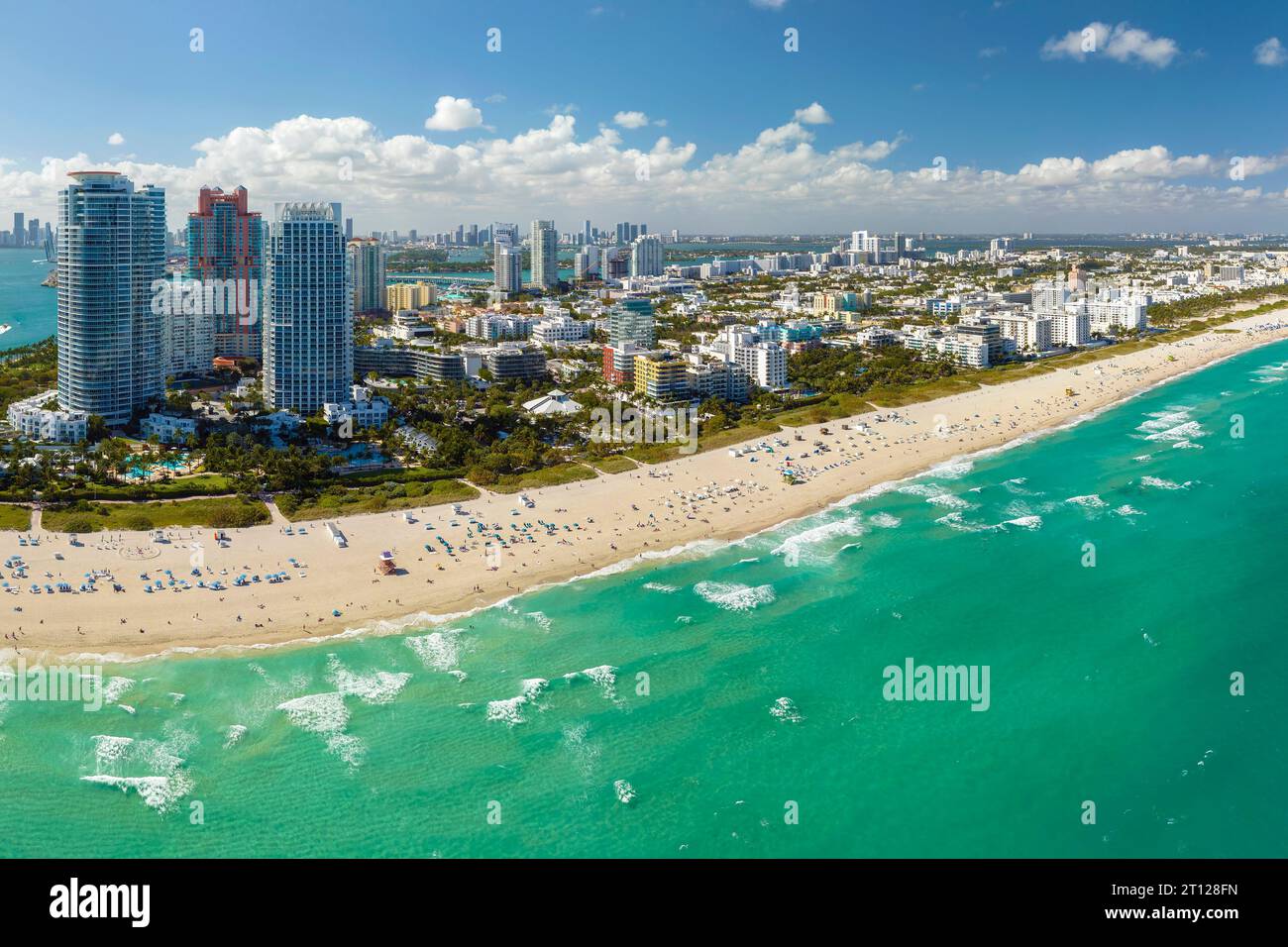 Aerial view of South Beach sandy surface with tourists relaxing on hot ...