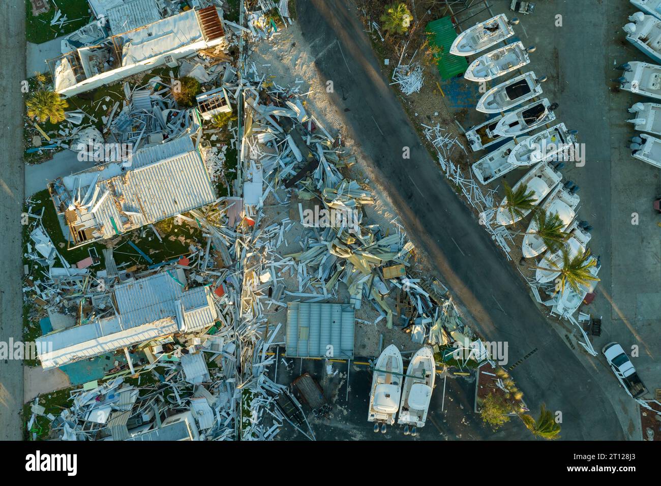 Aftermath of natural disaster in southern Florida. Badly damaged mobile ...