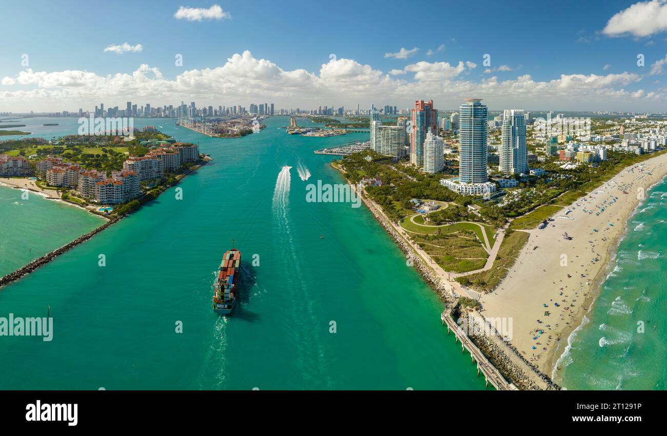 Commercial container ship entering Miami port harbor through main ...
