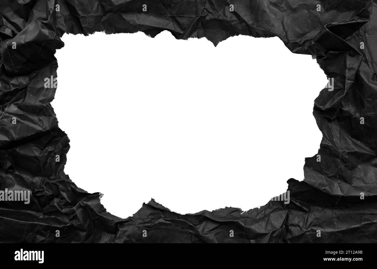 Black paper background with copy space. Hole on a crumpled dark sheet ...