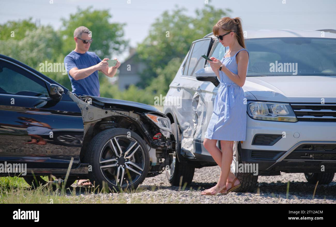 Sad drivers photographing on cellphone camera wrecked vehicles on ...