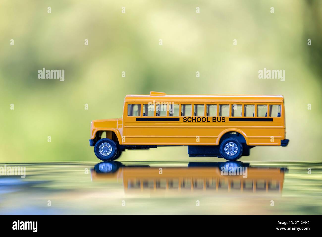 Small model of american yellow school bus as symbol of education in the ...