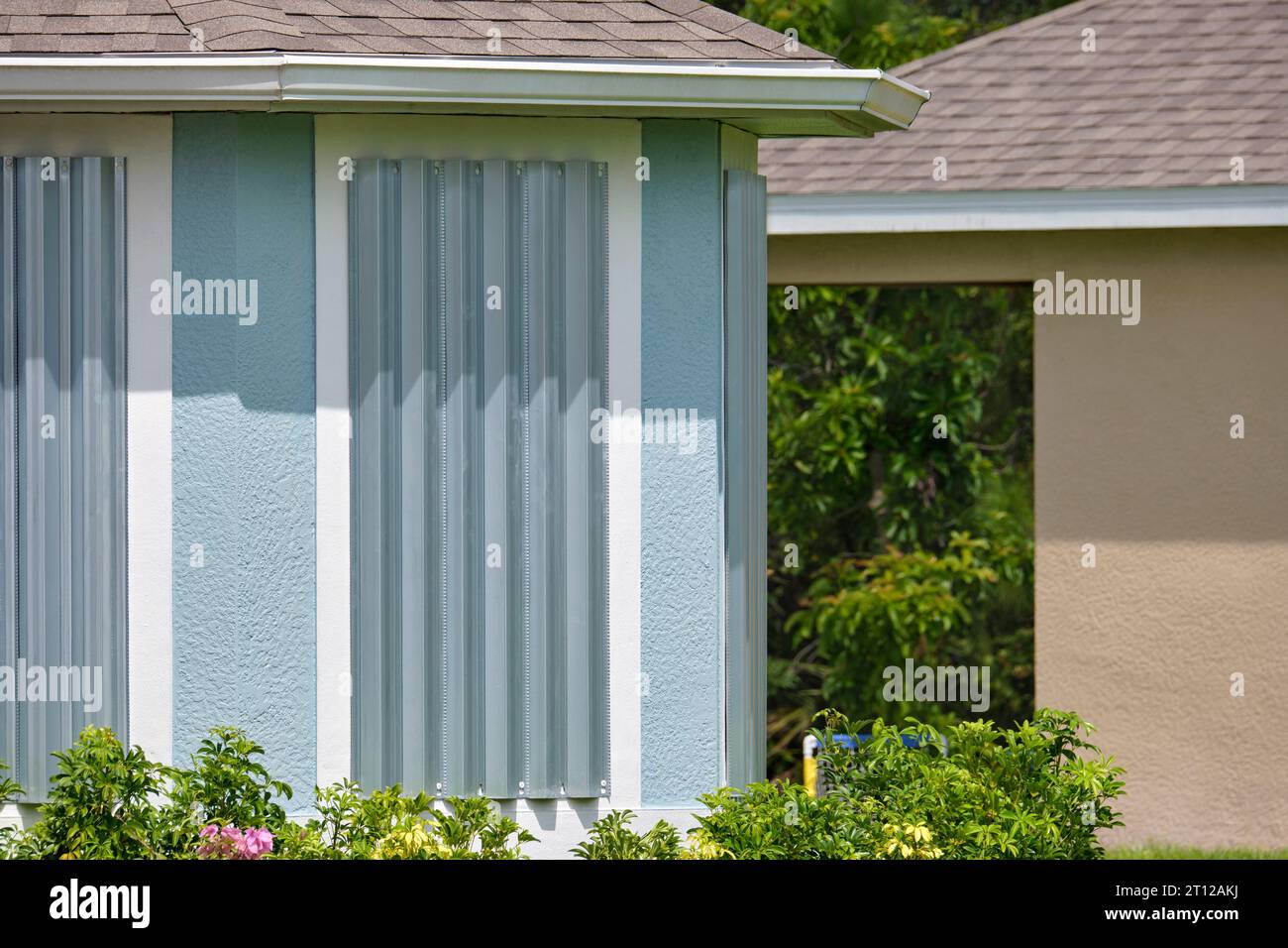 Steel sheets mounted as storm shutters for hurricane protection of ...
