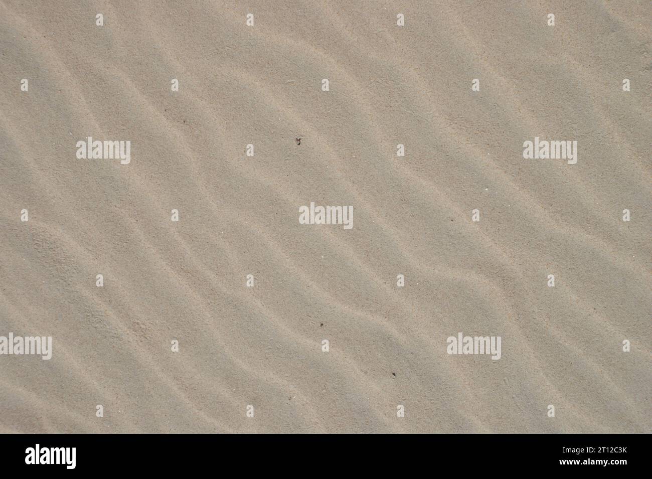 Wavy sea sand background. Top view Stock Photo - Alamy