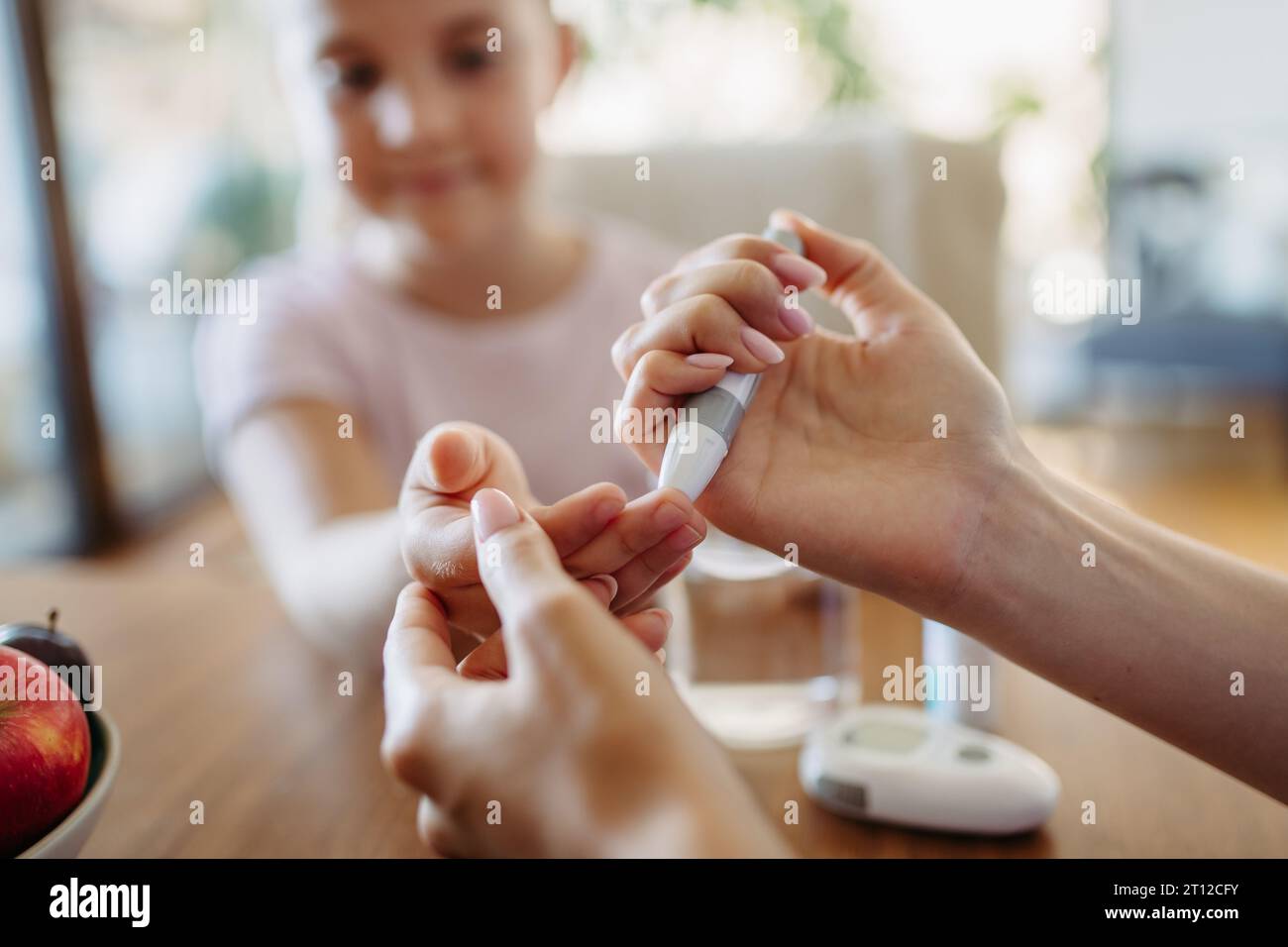 Blood glucose monitoring fingerstick hi-res stock photography and ...