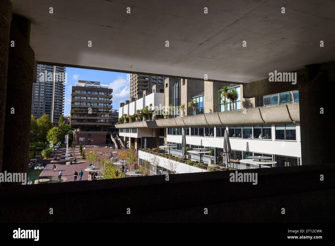 People sitting on the Lakeside terrace in front of the Barbican Centre ...