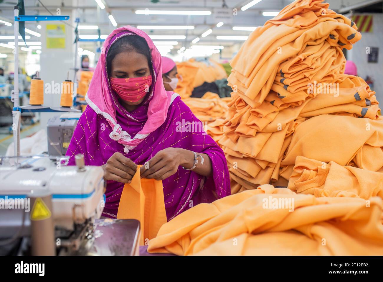 Garment workers work at the Surma Garments Limited in Savar Stock Photo ...