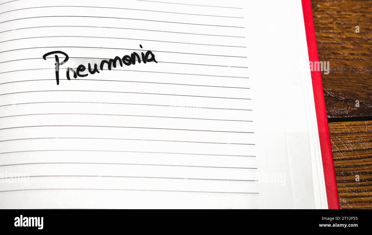Pneumonia, handwriting text on page of office agenda. Copy space Stock ...