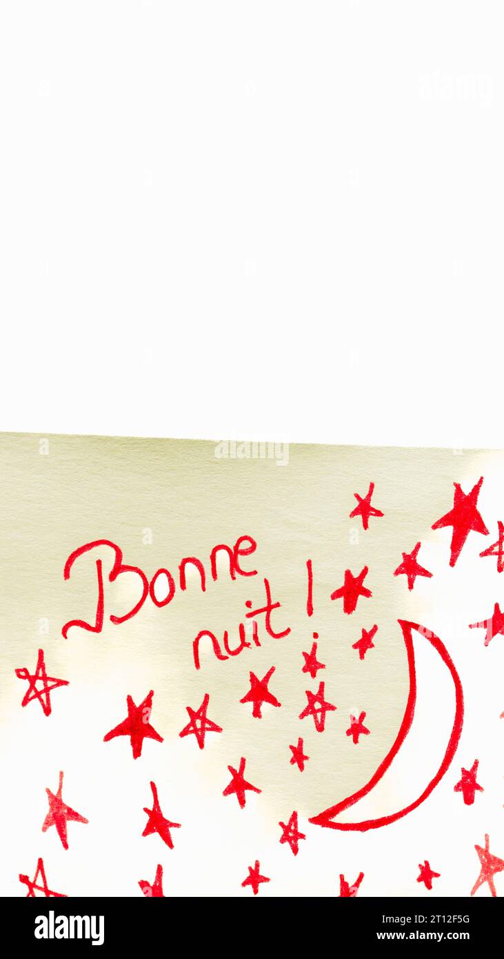 Bonne nuit (good night) handwriting text close up isolated on yellow ...