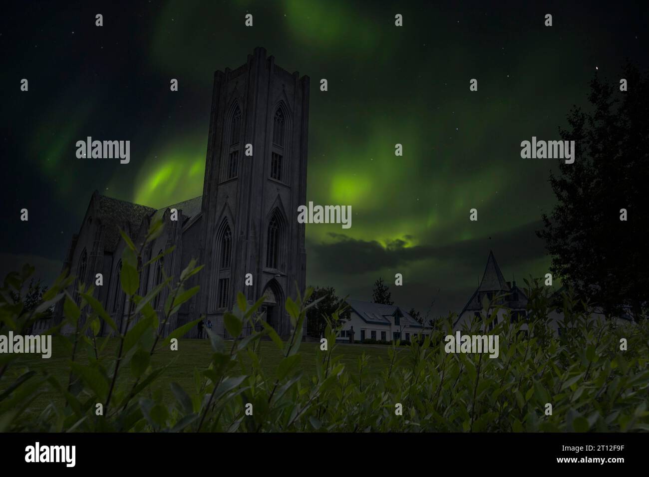 A beautiful Reykjavik church one night with a beautiful Northern Lights ...