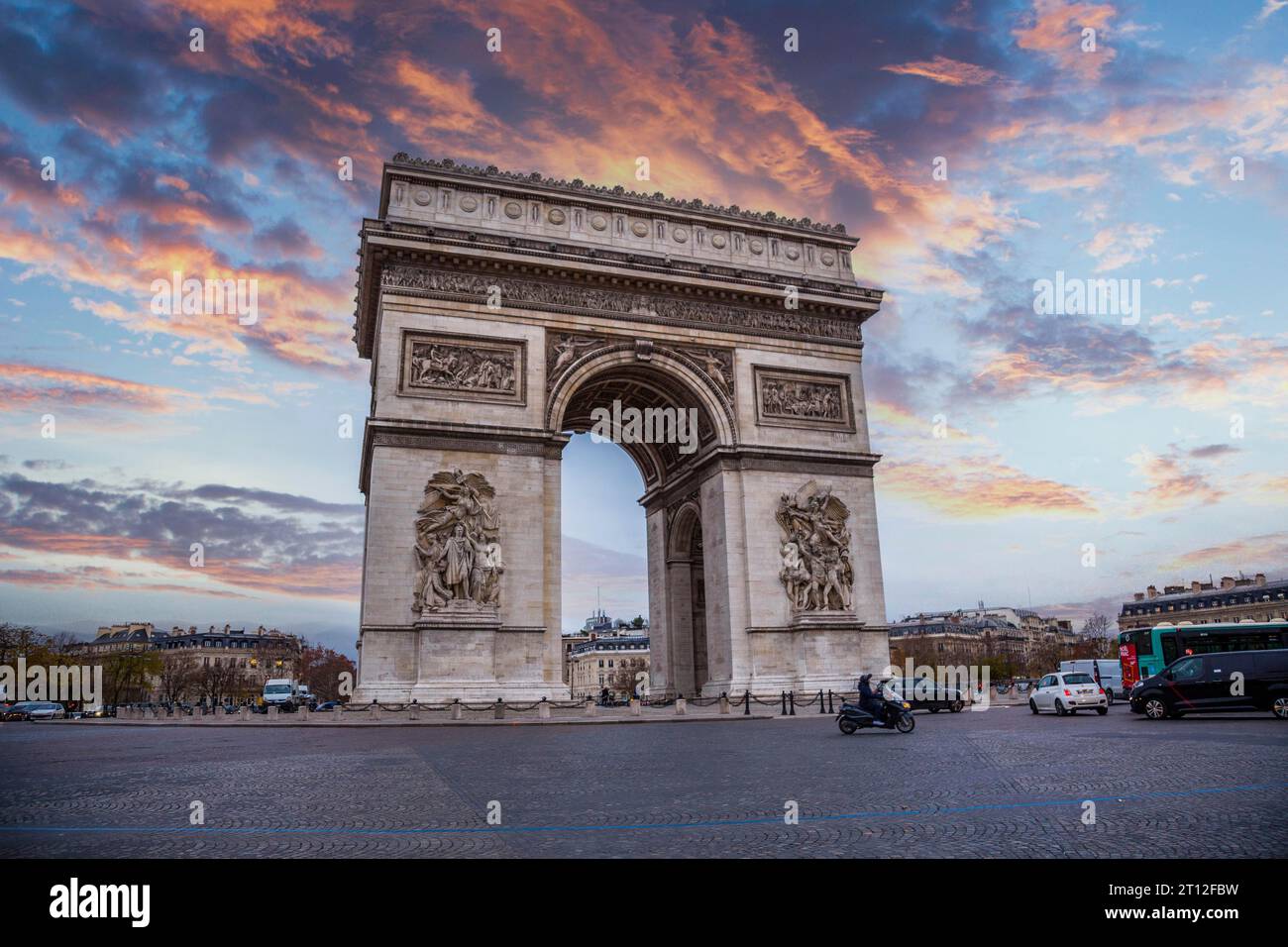 A beautiful sunset in the city of love at the Arc de Triomphe, Paris ...