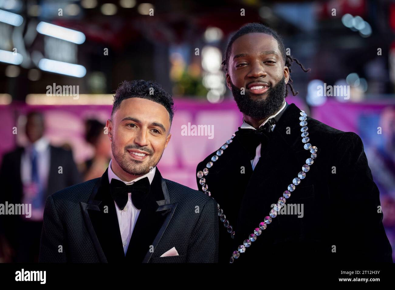 Adam Deacon, left, and Jazzie Zonzolo pose for photographers upon ...
