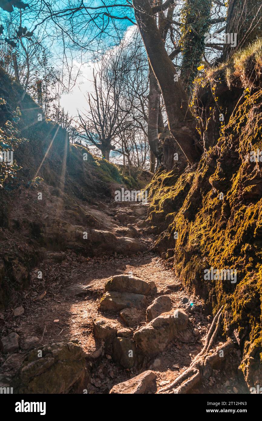 Mud ramps on the trail of Mount Adarra in Guipuzcoa with sunshine above ...
