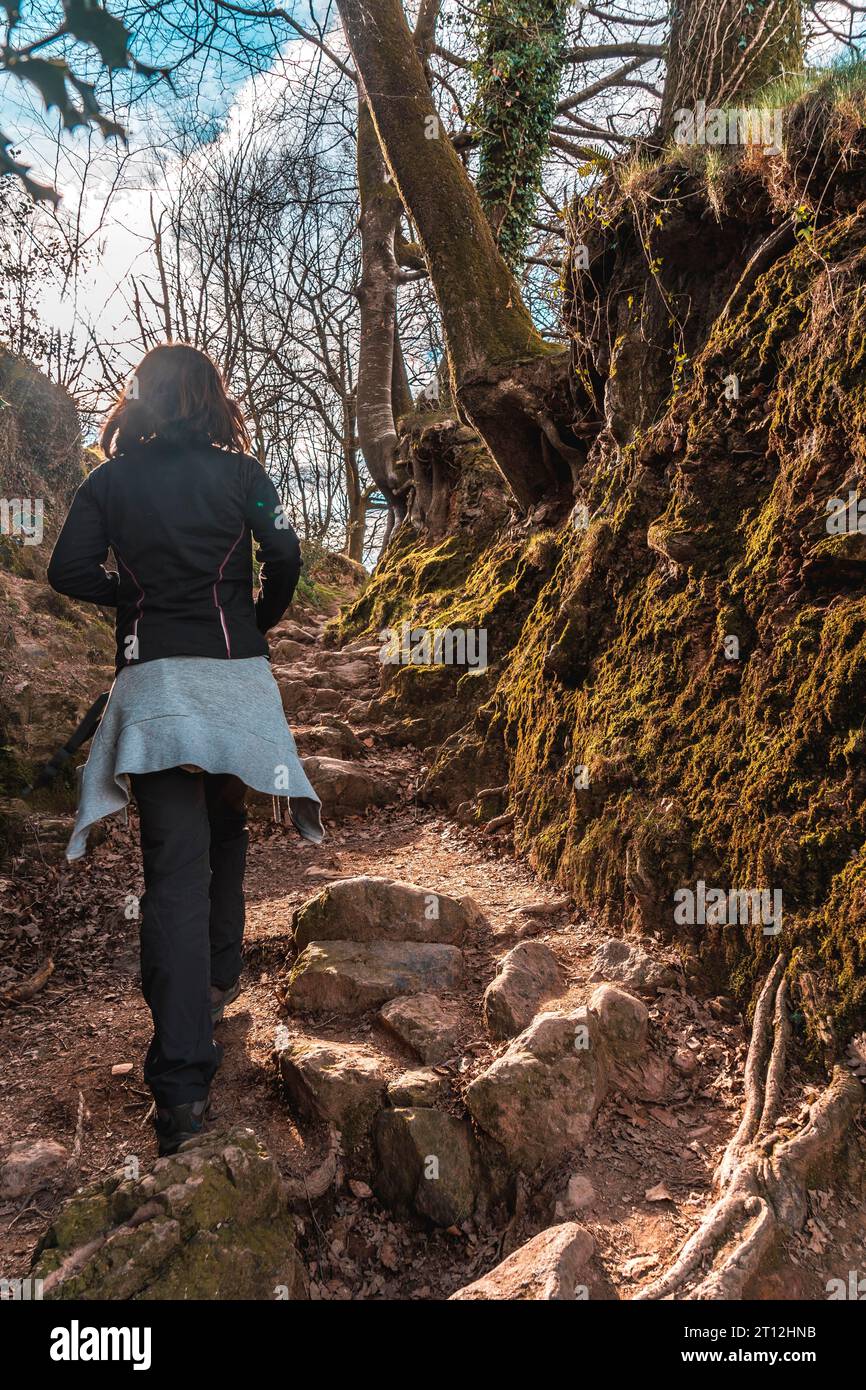 A Young Girl In Black In The Mud Ramps Of The Trail Of Mount Adarra In