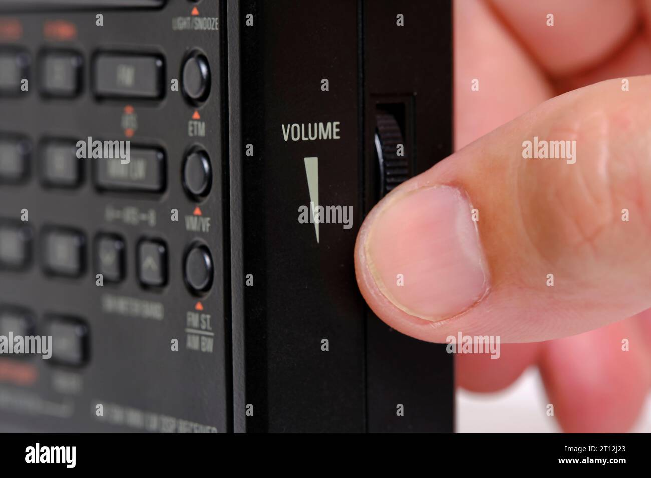 Fingers scroll volume wheel radio Stock Photo - Alamy