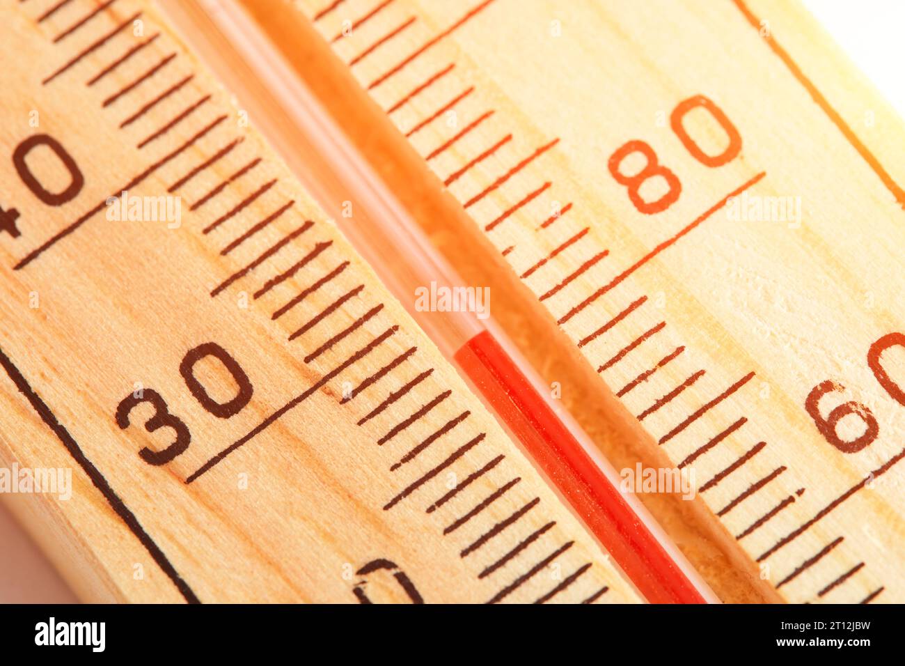 Wooden outdoor thermometer showing temperature thirty degrees Celsius ...