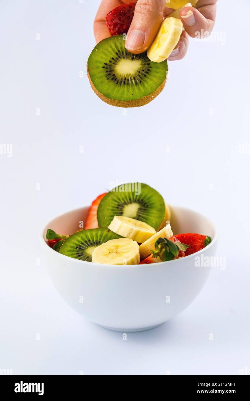 Recipe of a fruit salad with kiwis, strawberries, bananas Stock Photo ...