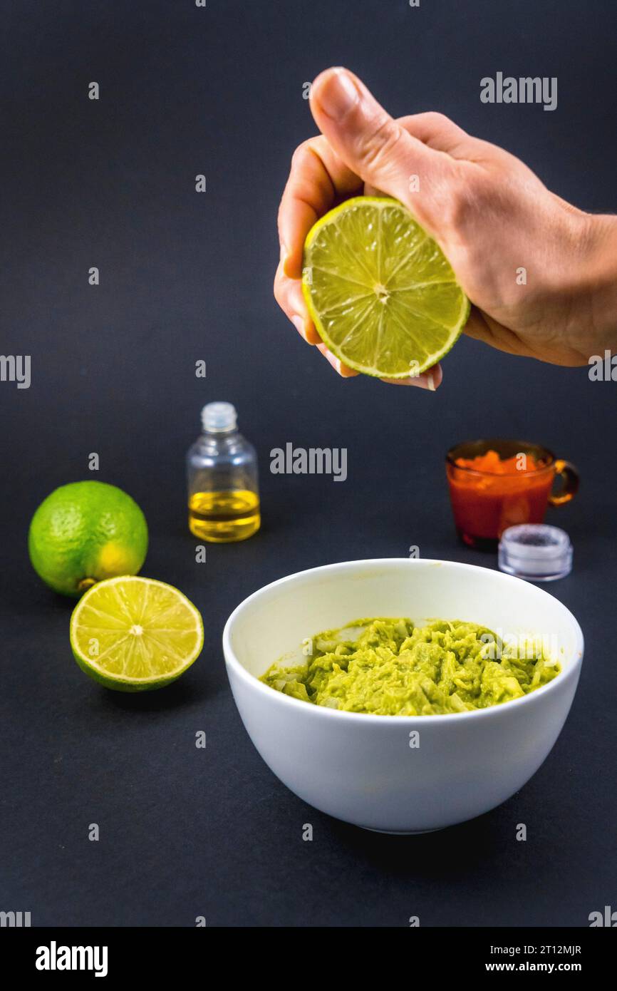 We put a little lime. Recipe to prepare a nice guacamole Stock Photo ...