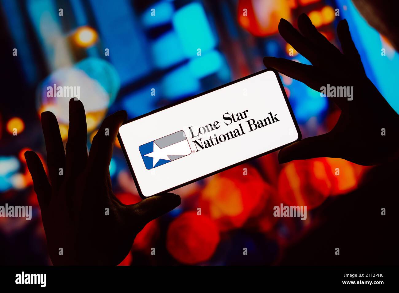 In this photo illustration, the Lone Star National Bank (LSNB) logo is ...