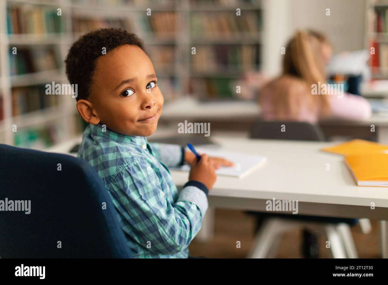 Smart boy looking camera diverse hi-res stock photography and images ...