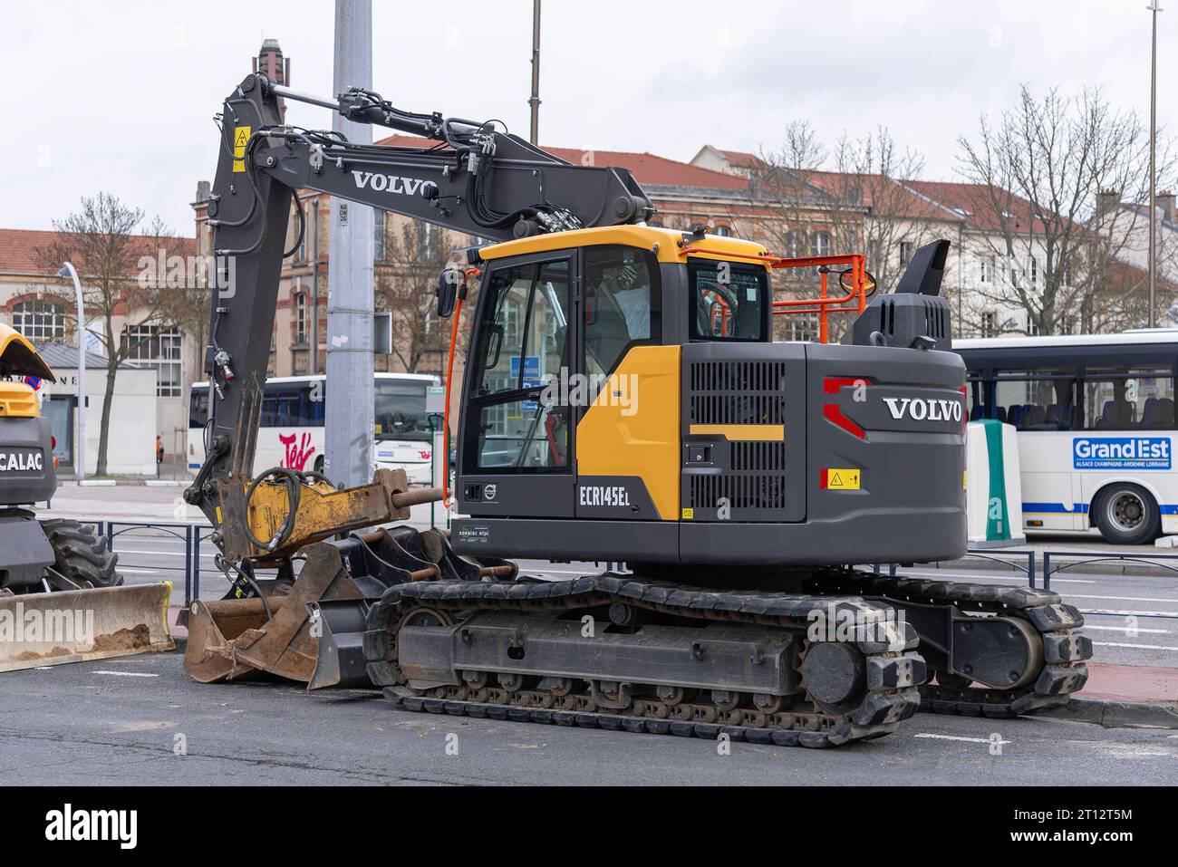 Dark grey and yellow crawler excavator Volvo ECR145EL in the street ...