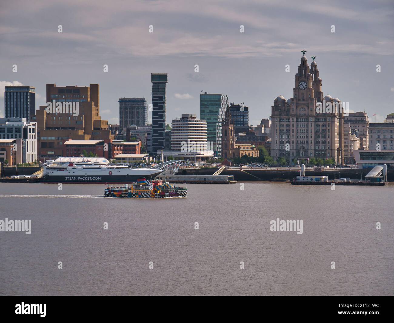The River Mersey ferry Snowdrop passes the historic Liverpool ...