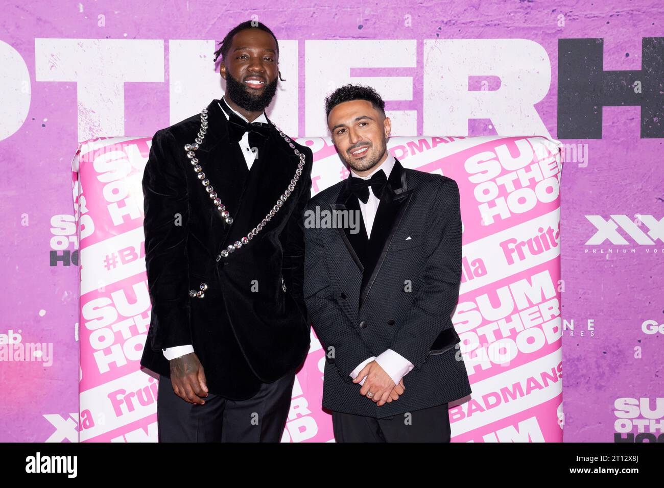 Jazzie Zonzolo, left, and Adam Deacon pose for photographers upon ...