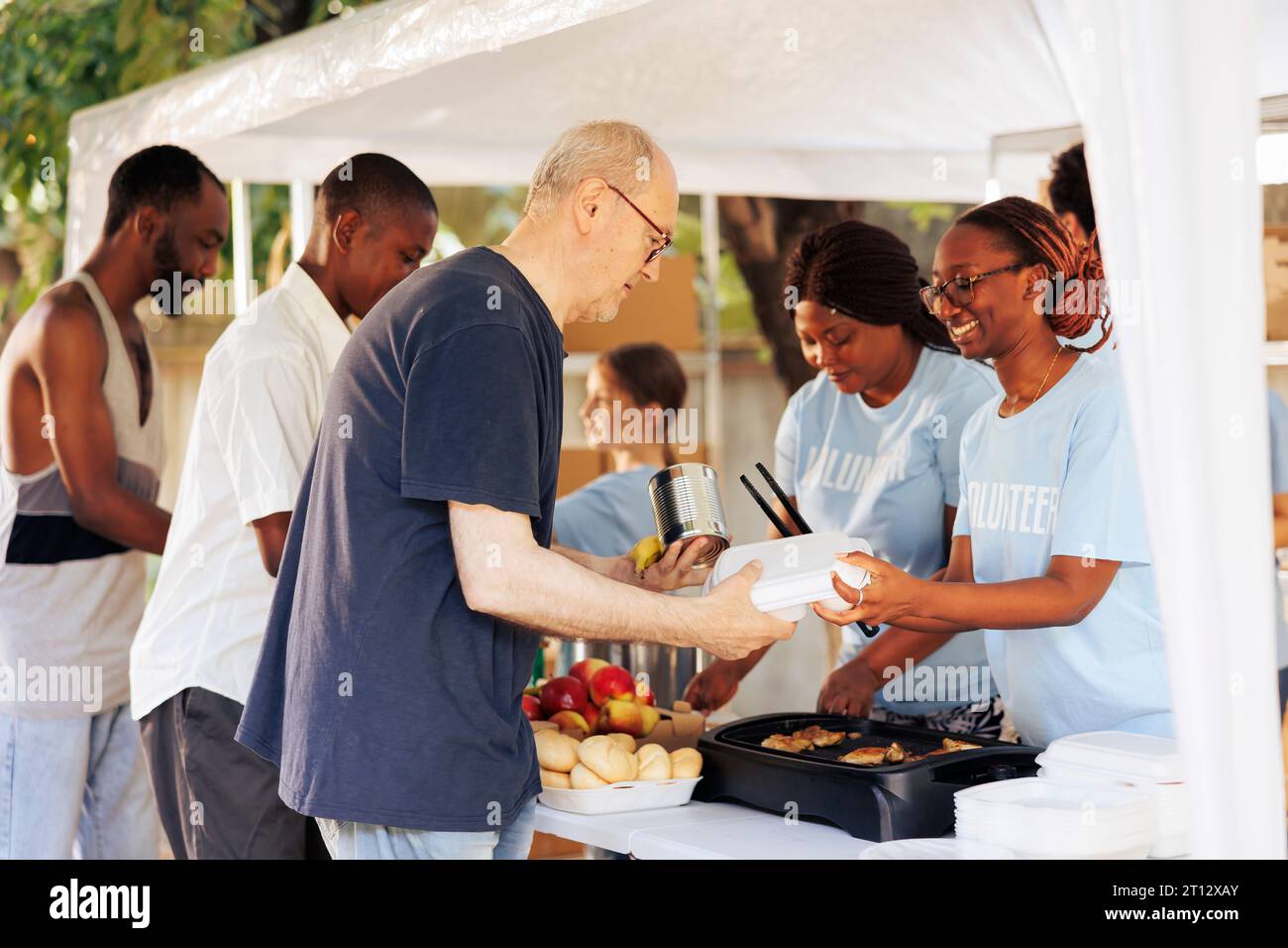 Homeless people from different backgrounds receive comforting meals ...
