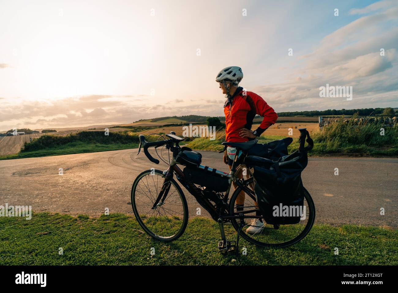 Traveller on bicycle. Solo travel long distance bicycle touring concept ...