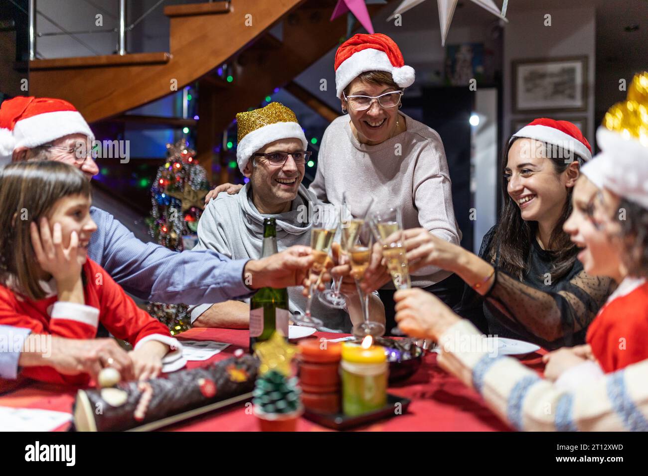 Multi generational spanish family celebrating christmas dinner at home ...