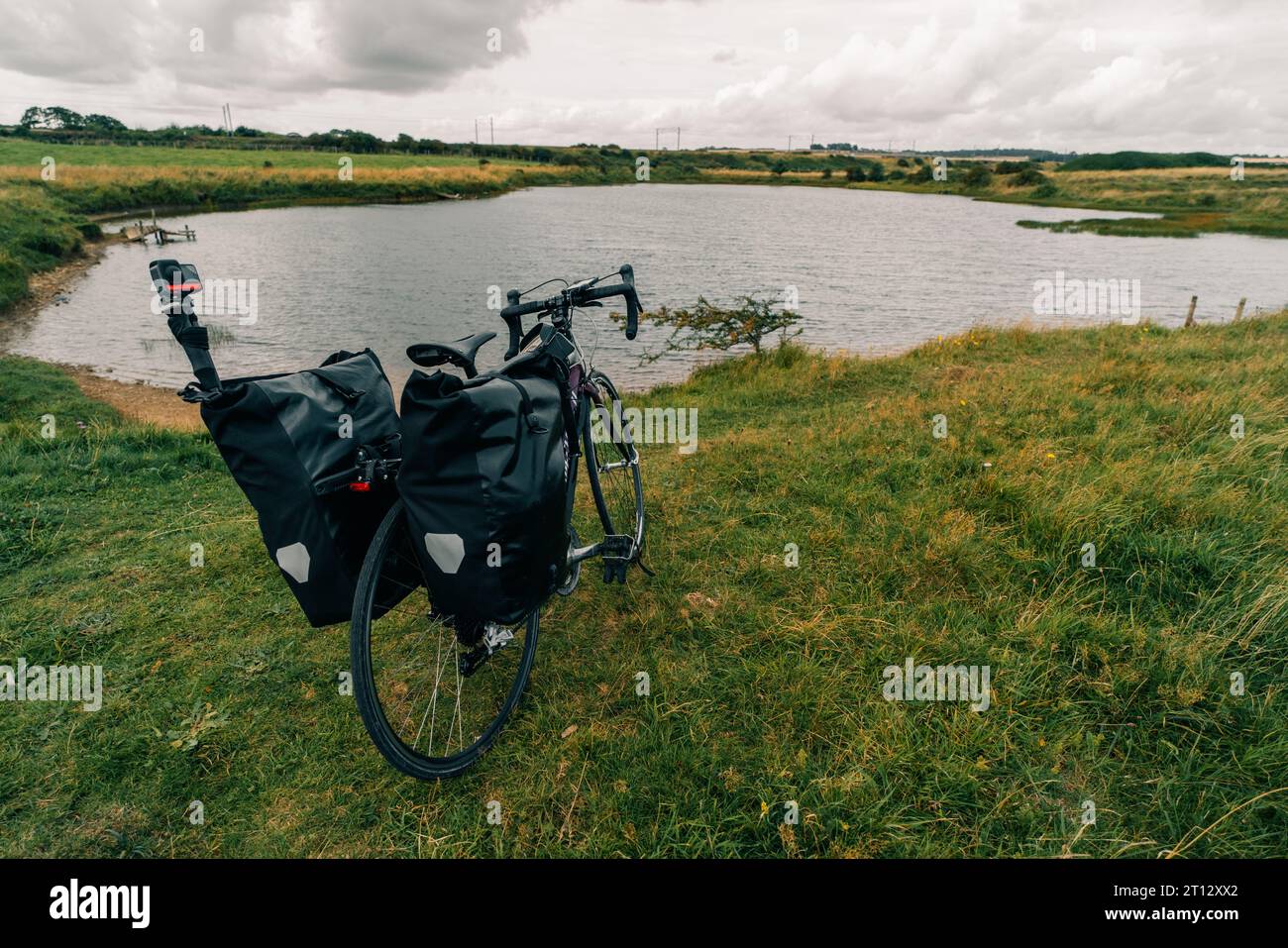Traveller on bicycle. Solo travel long distance bicycle touring concept ...