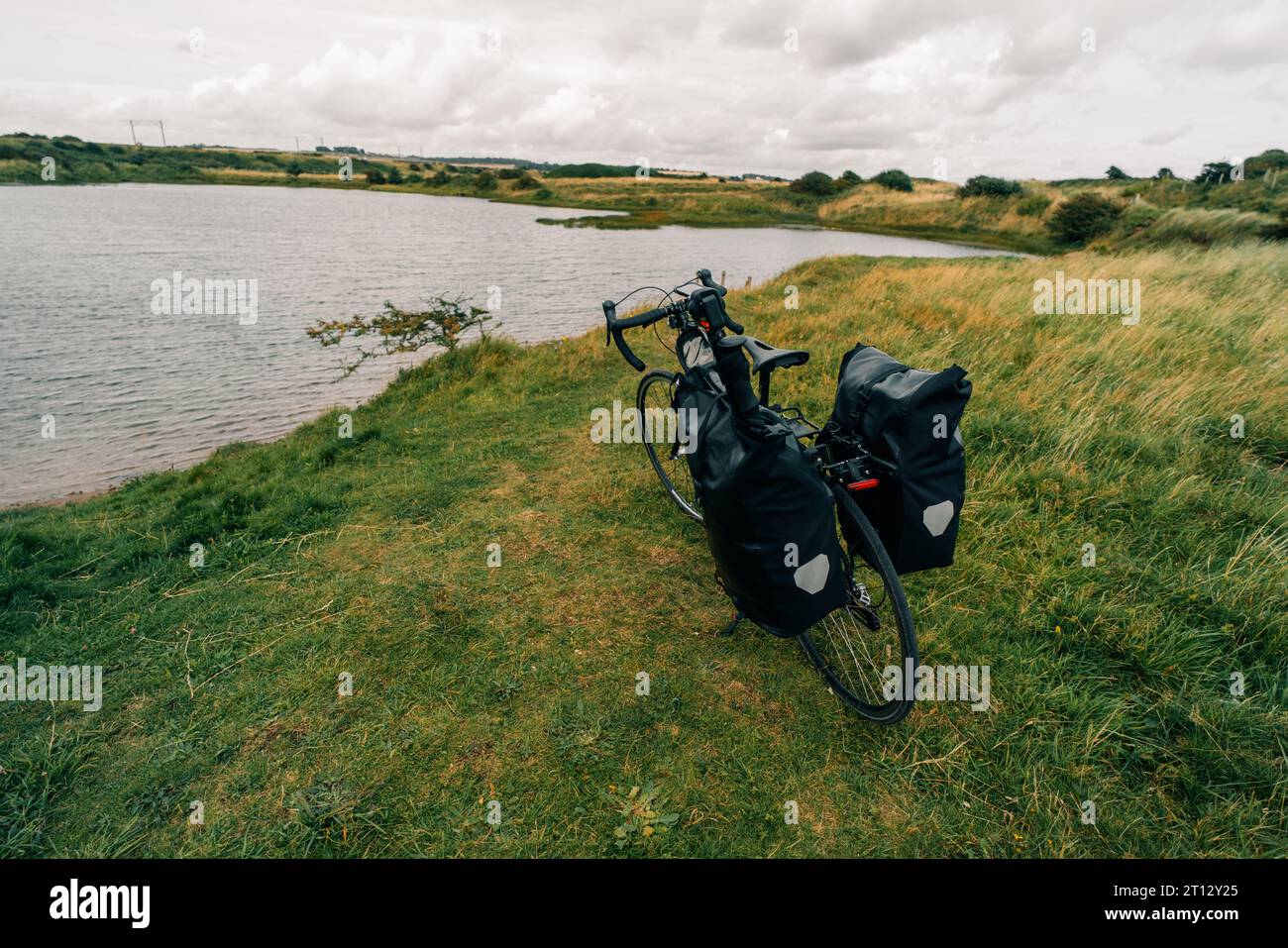 Traveller on bicycle. Solo travel long distance bicycle touring concept ...