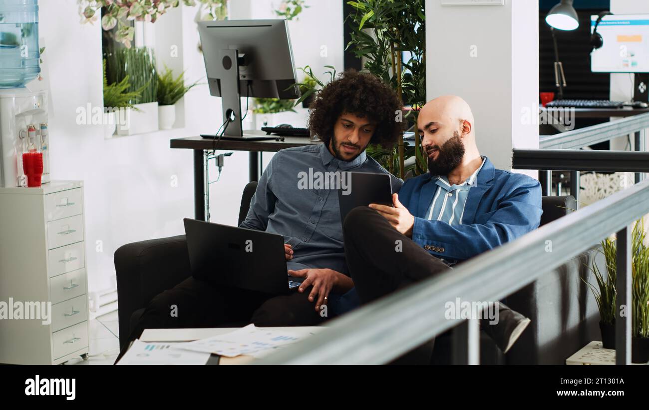 Two business people comparing notes hi-res stock photography and images ...