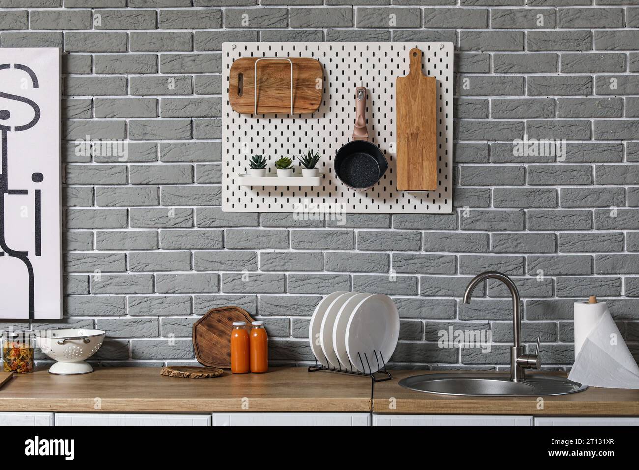Sink, plate rack and utensils on counters in modern kitchen Stock Photo ...