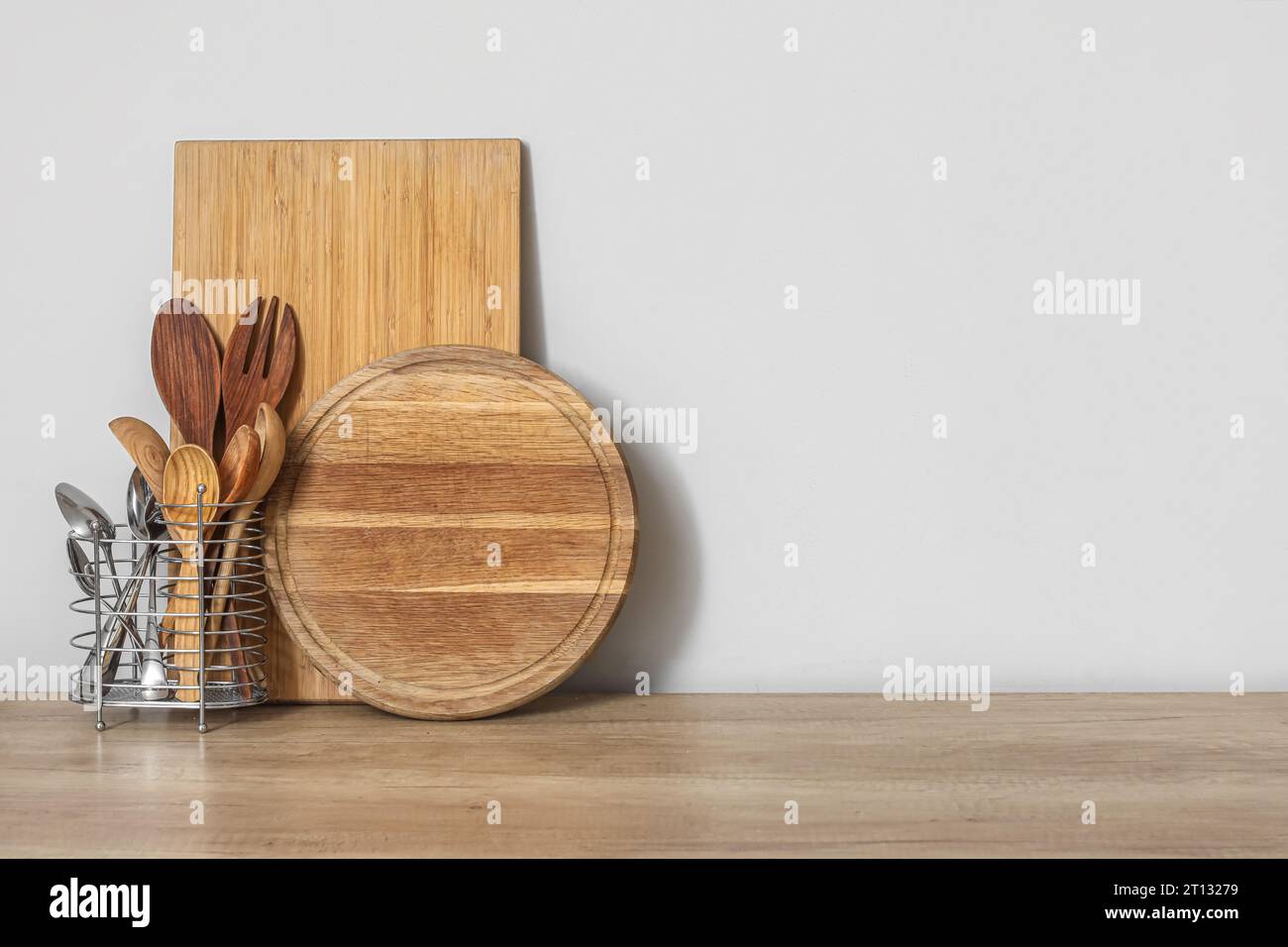 Wooden kitchen counter with cutting boards and utensils Stock Photo - Alamy