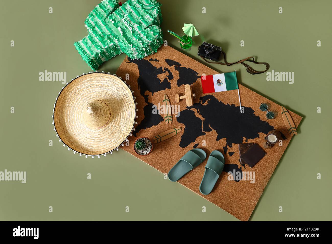 Pinata with map, Mexican flag and beach accessories on green background ...