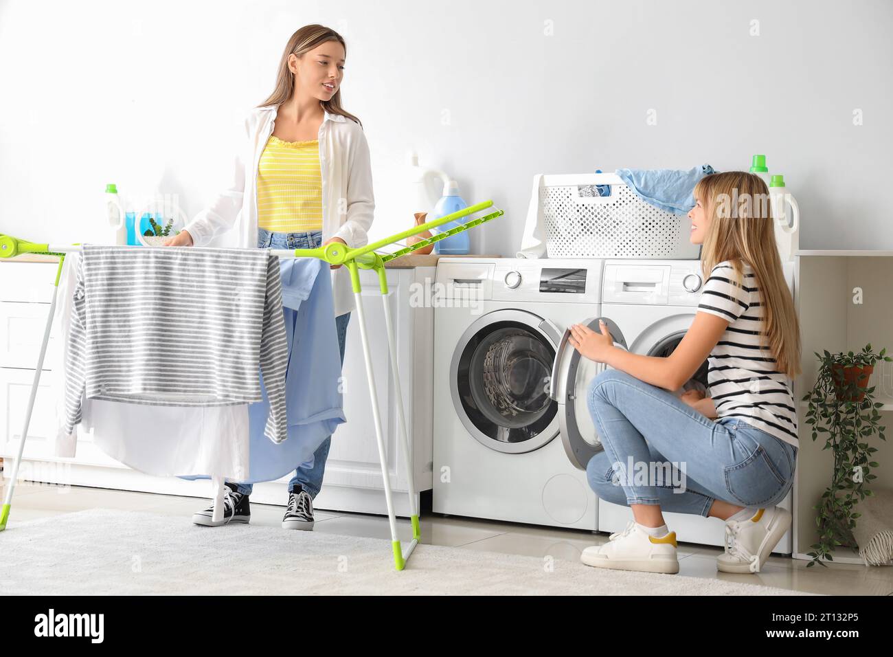 Female students doing laundry in dormitory Stock Photo - Alamy
