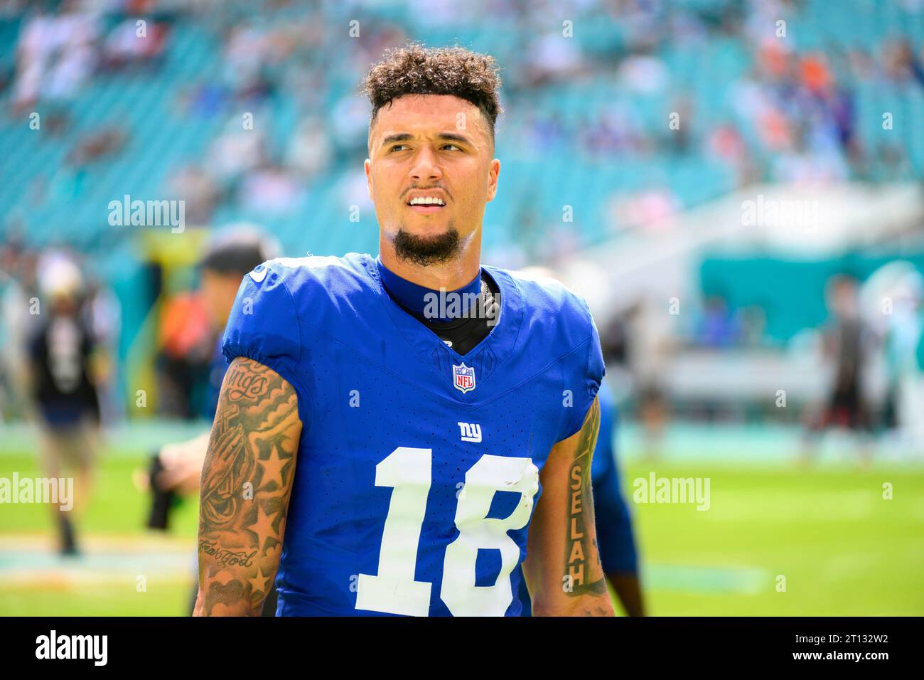 New York Giants wide receiver Isaiah Hodgins (18) walks on the field ...