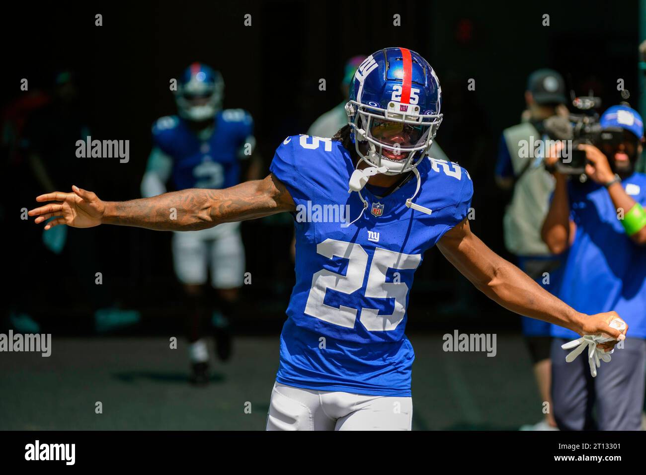New York Giants cornerback Deonte Banks (25) reacts as he runs onto the field before an NFL ...