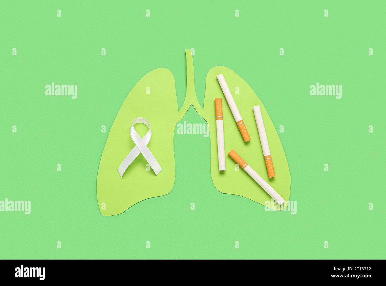 Paper lungs with cigarettes and white ribbon on green background. Lung ...