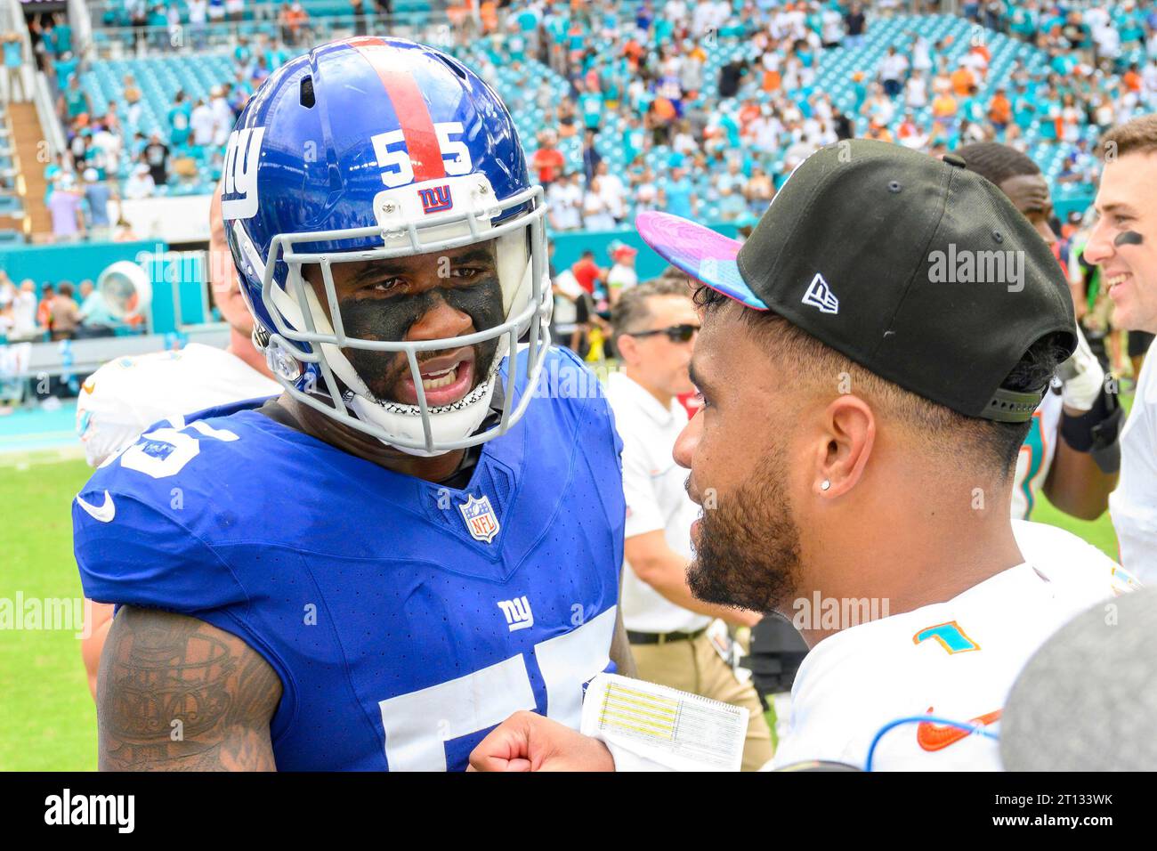 New York Giants linebacker Jihad Ward (55) talks with Miami Dolphins ...