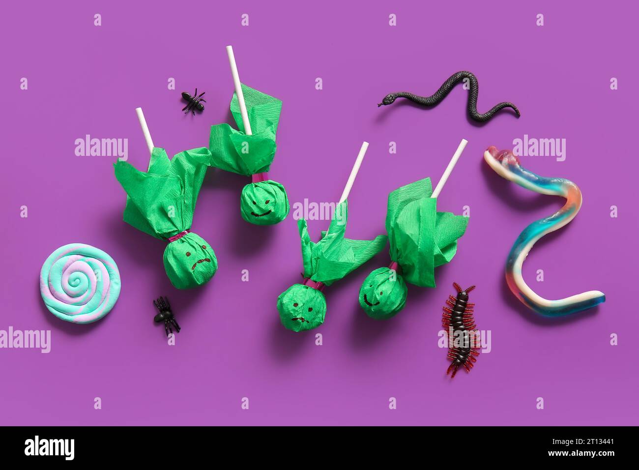 Sweet lollipops with jelly snakes and candy for Halloween party on ...