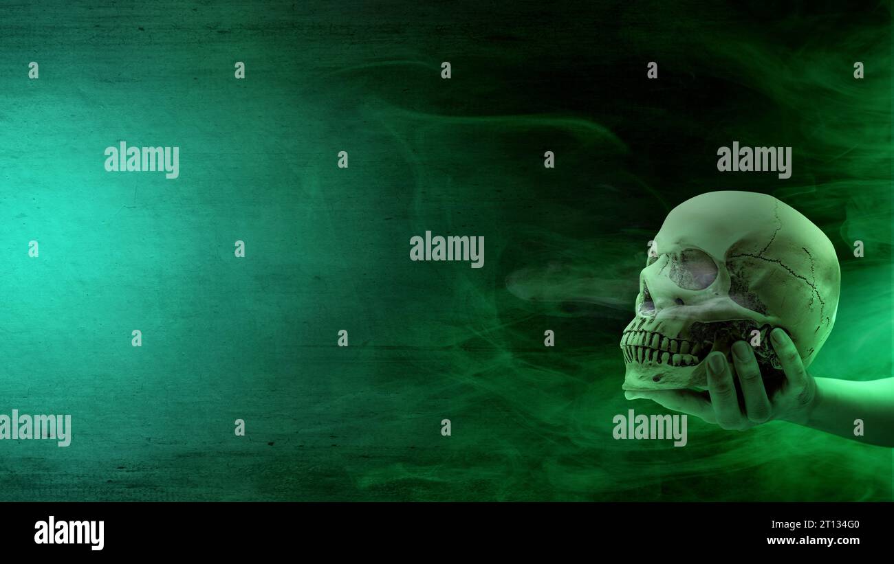 Dark human skull hand holding hi-res stock photography and images - Alamy