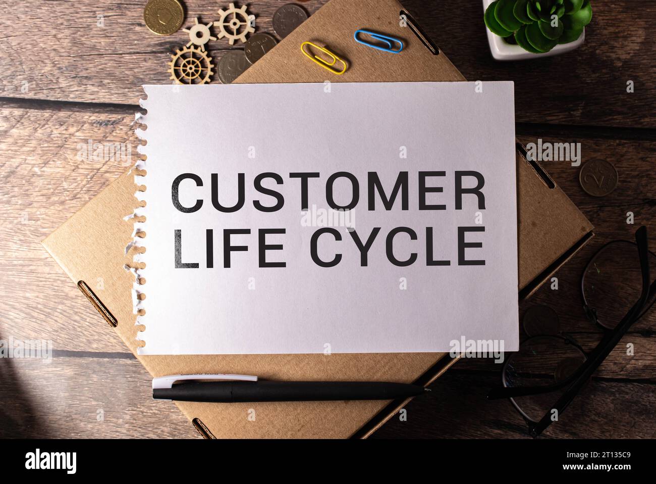 CUSTOMER LIFE CYCLE text on a blue background with keyboard and ...