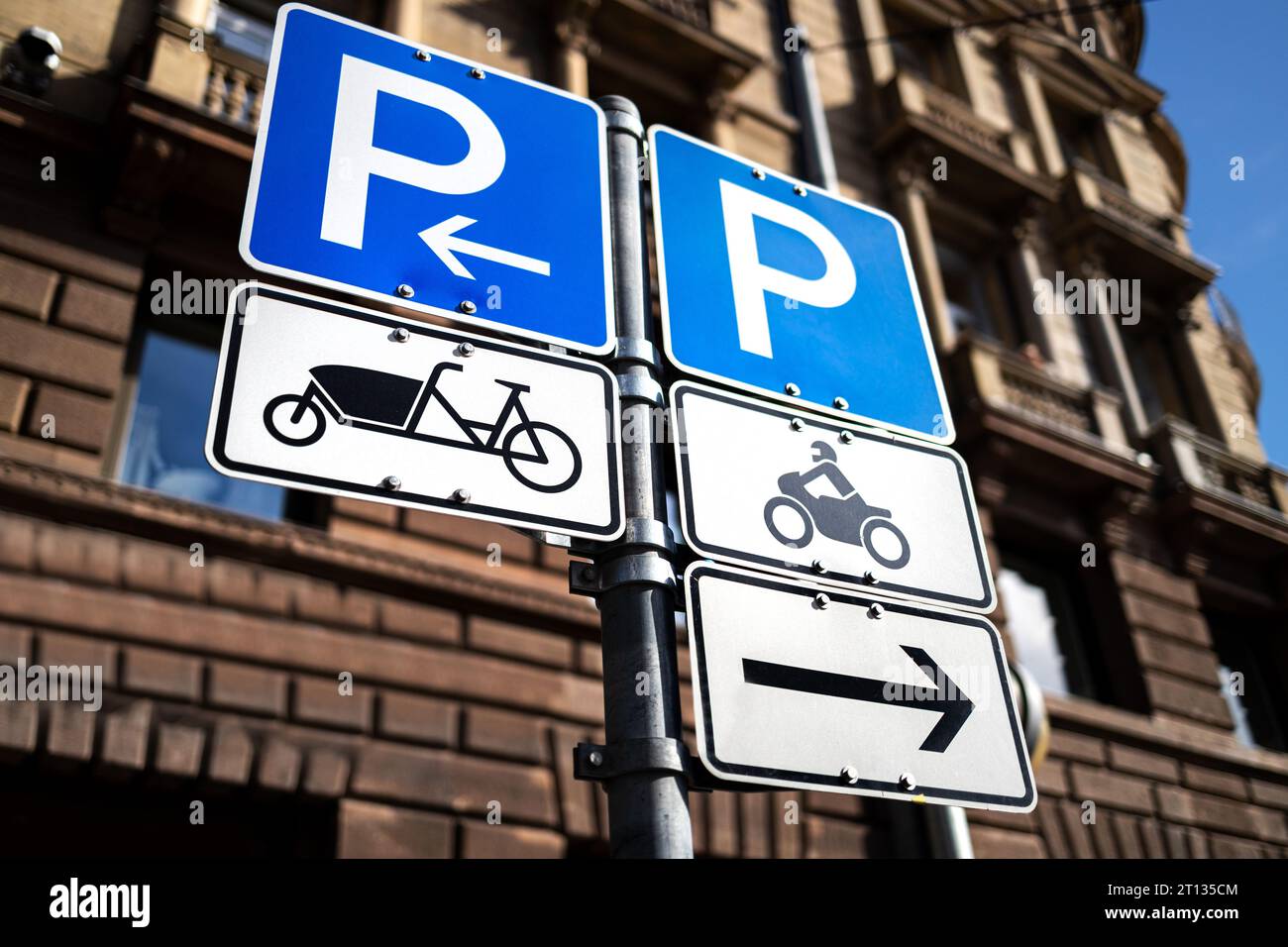 a german Cargo bike and a motorcycle parking sign Stock Photo - Alamy