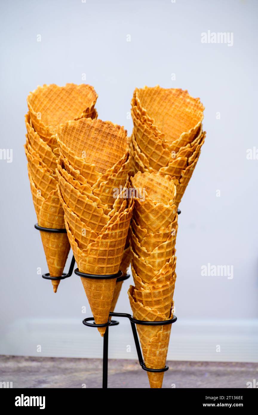 Fresh baked empty cones for ice cream, food background Stock Photo - Alamy