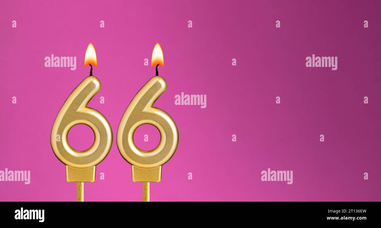 Birthday card with candle number 66 - purple background Stock Photo - Alamy