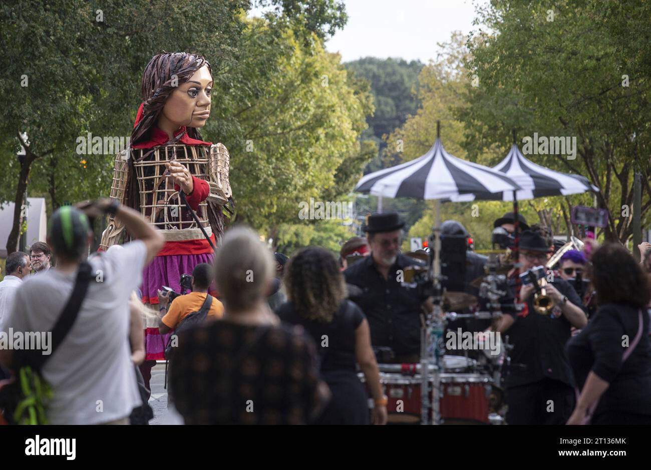 Little Amal, a 12-foot-tall puppet of a 10-year-old Syrian refugee girl ...