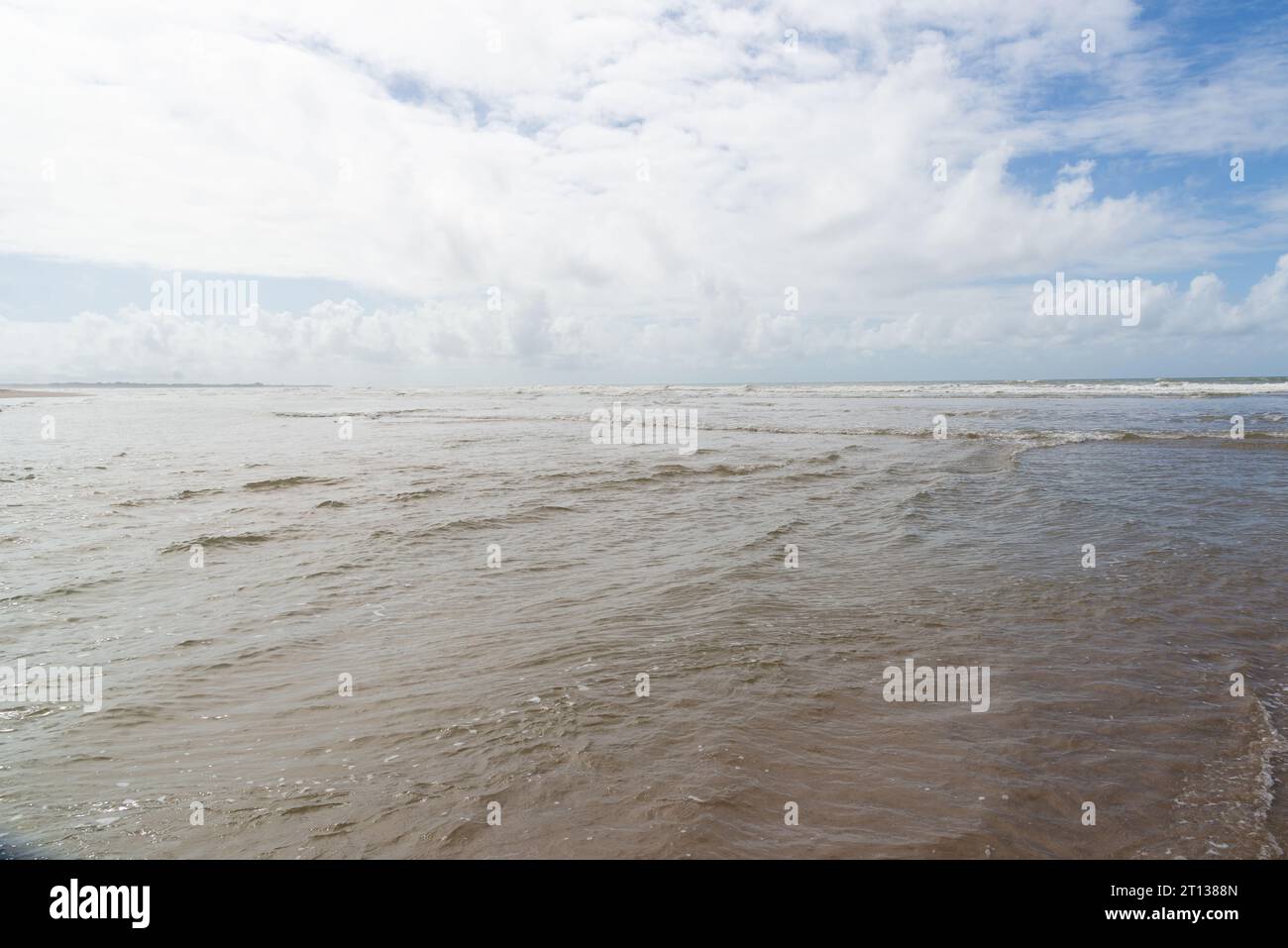Waters from a river that flows into the sea. white sand on the beach ...