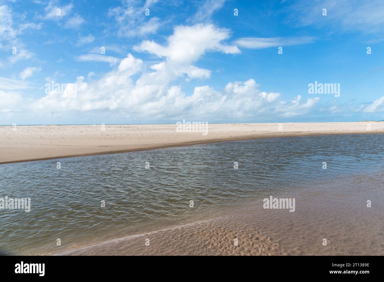 Waters from a river that flows into the sea. white sand on the beach ...